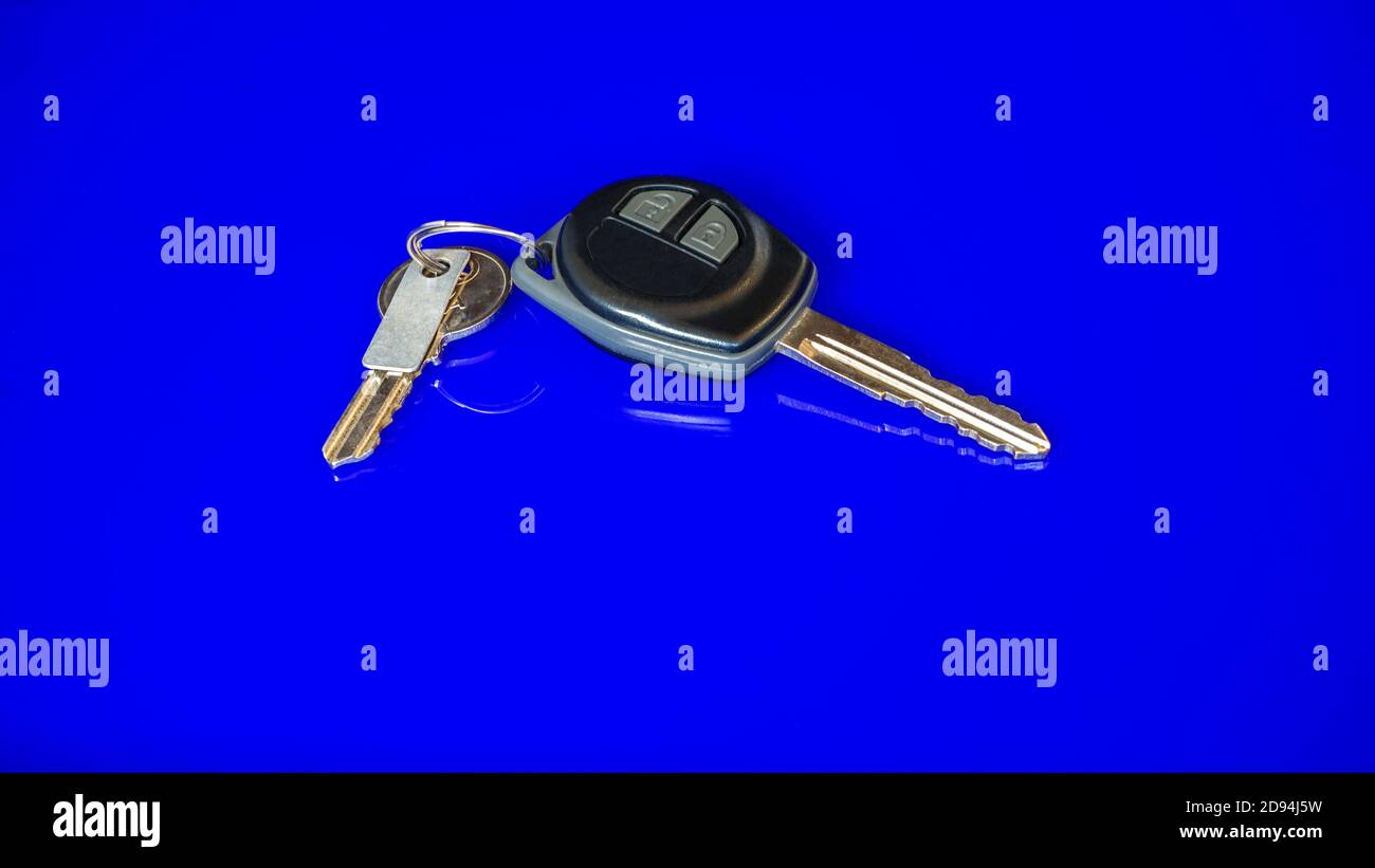 Car keys on blue background Stock Photo - Alamy
