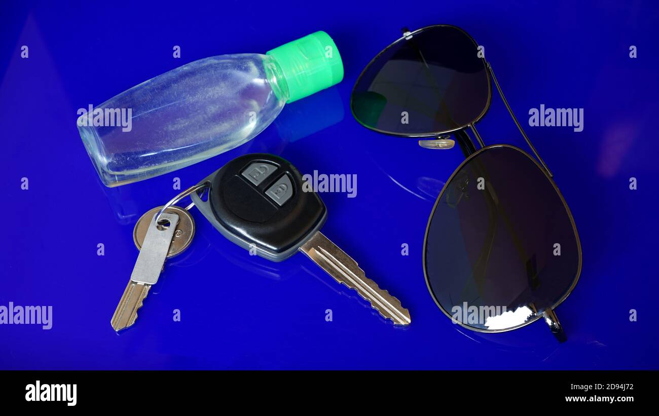 Car keys on blue background Stock Photo - Alamy