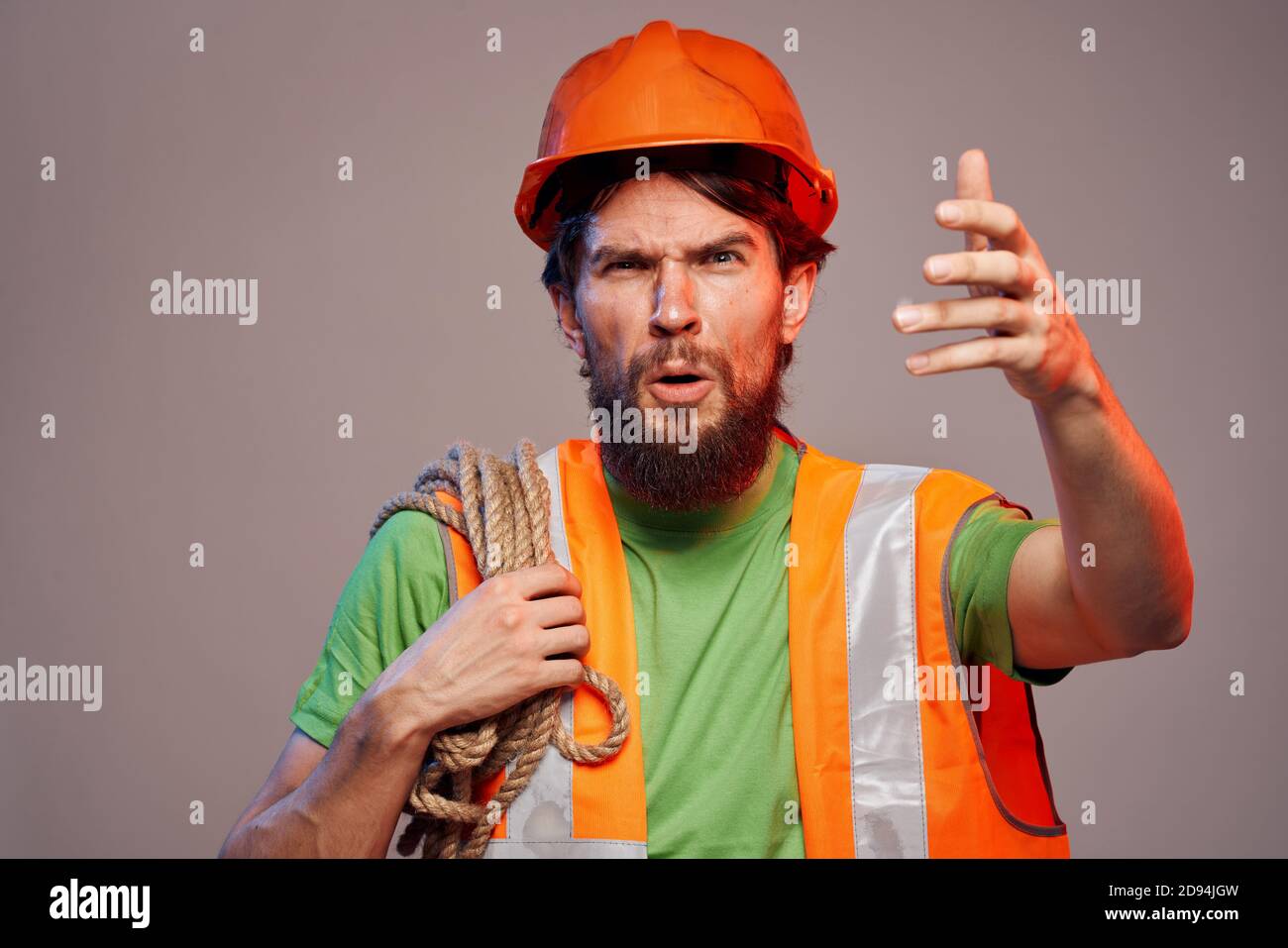 man in orange helmet work engineer professional tools Stock Photo - Alamy