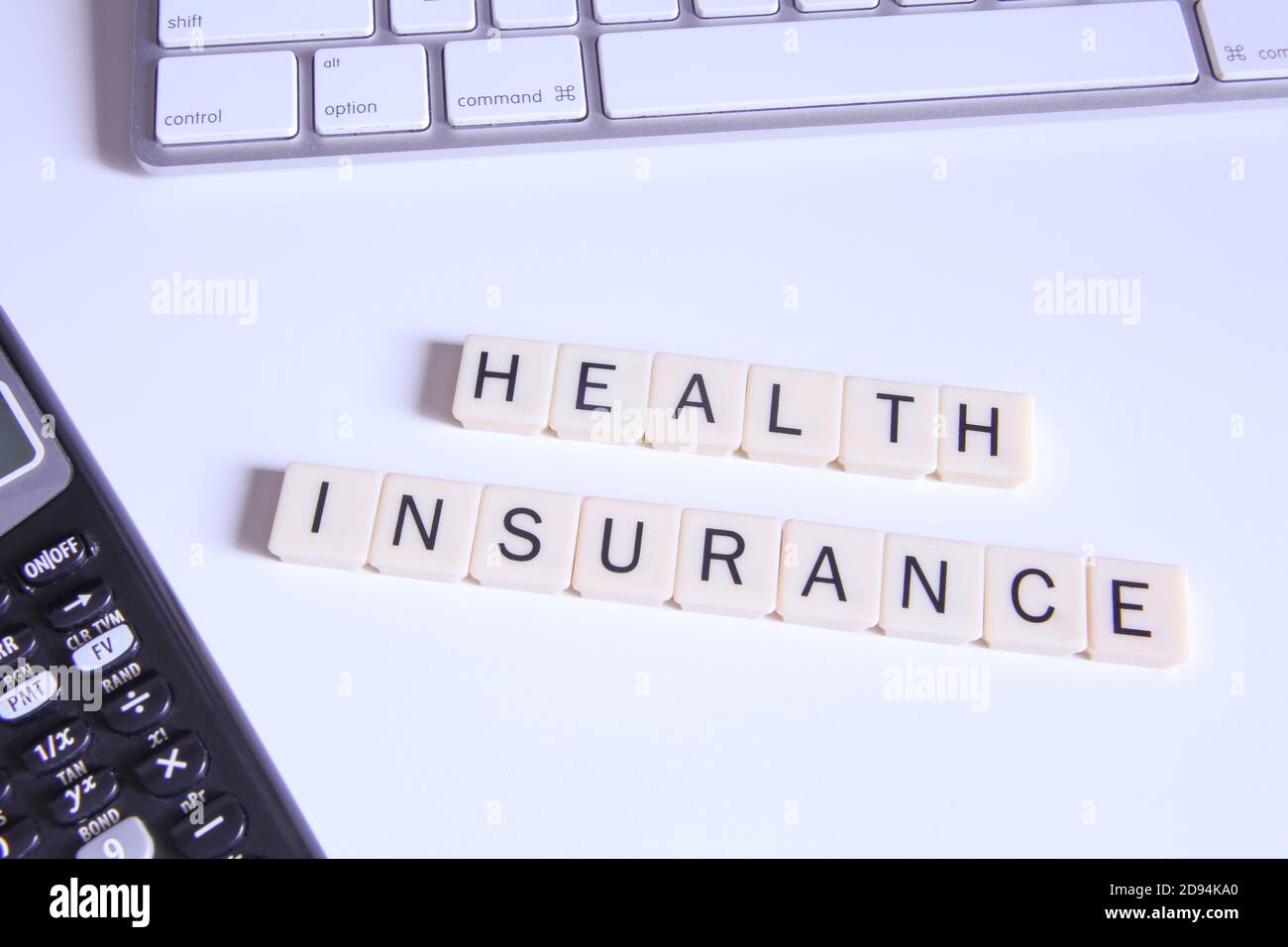 Health Insurance Conceptual Title. Top view of Connected Letters Game ...