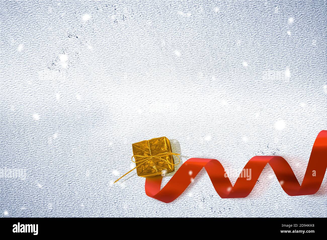 Christmas gift box on the snow with snowfall background Stock Photo - Alamy