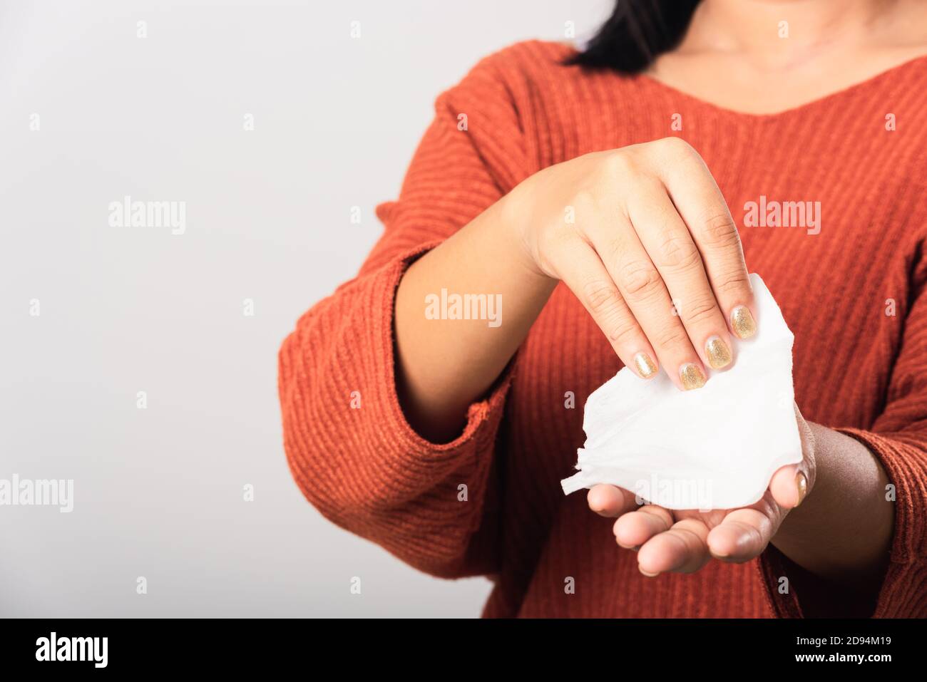 Close up hand of Asian woman she using wet tissue paper wipe cleaning ...