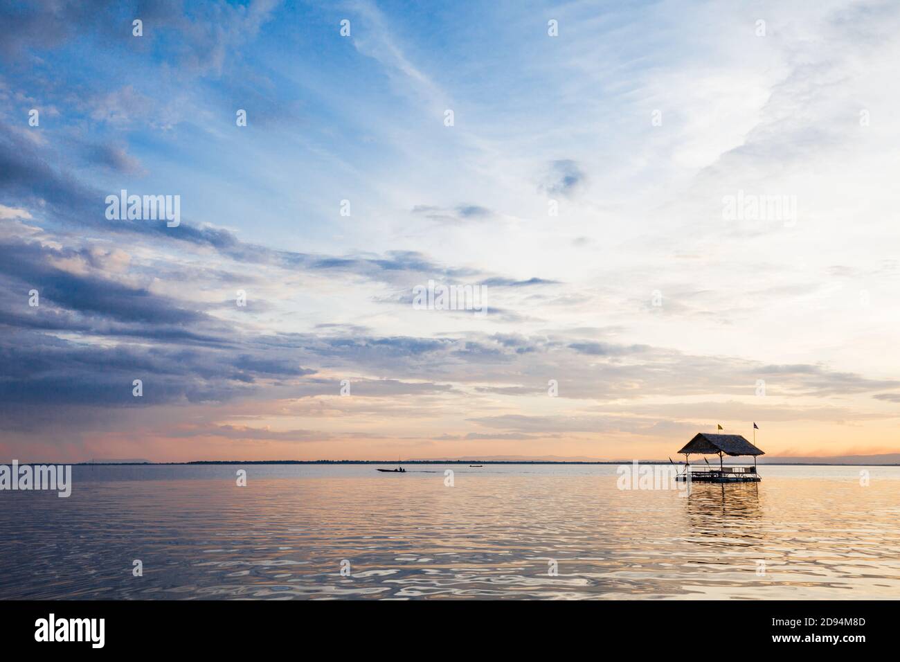 Pontoon floating in the water at sunset Stock Photo - Alamy