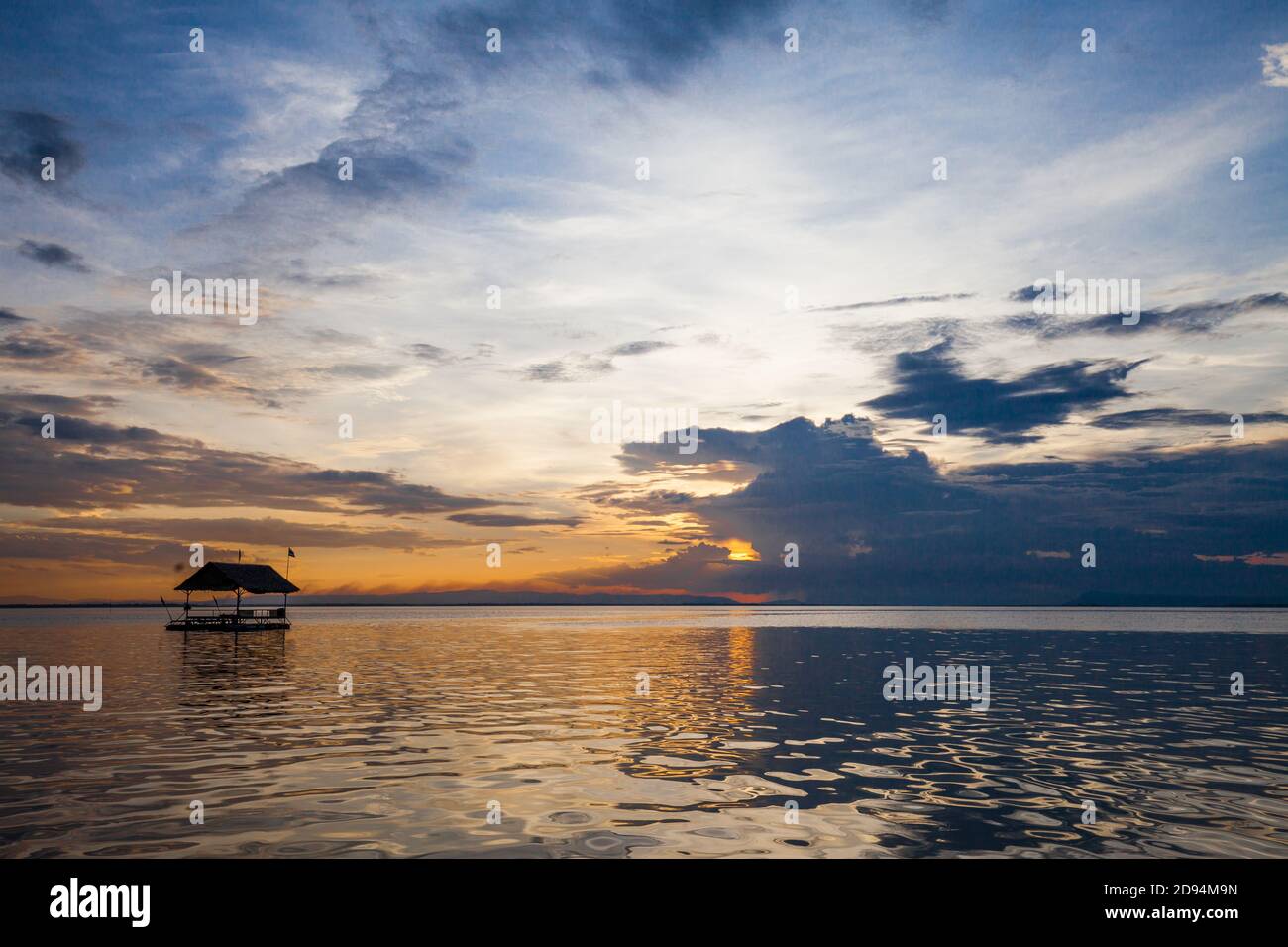 Pontoon floating in the water at sunset Stock Photo - Alamy