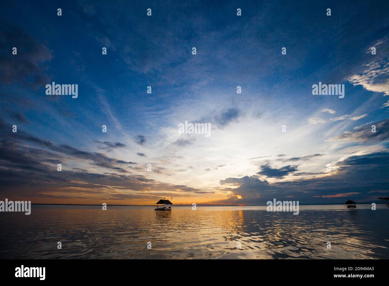Pontoon floating in the water at sunset Stock Photo - Alamy