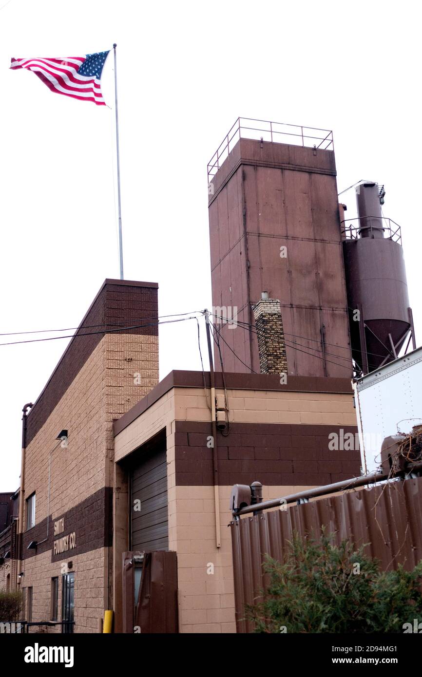 Attractive office building and factory proudly flying the American flag ...