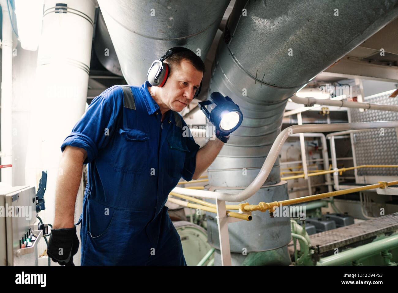 Marine engineer officer controlling vessel enginesand propulsion in ...