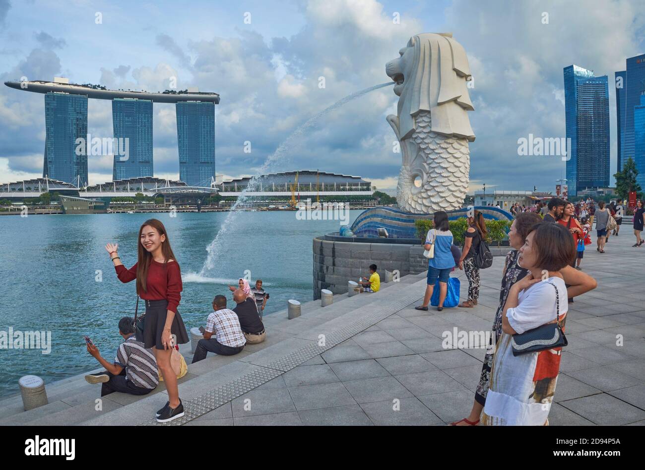 A female Asian tourist (l) poses for photos in front of the iconic ...