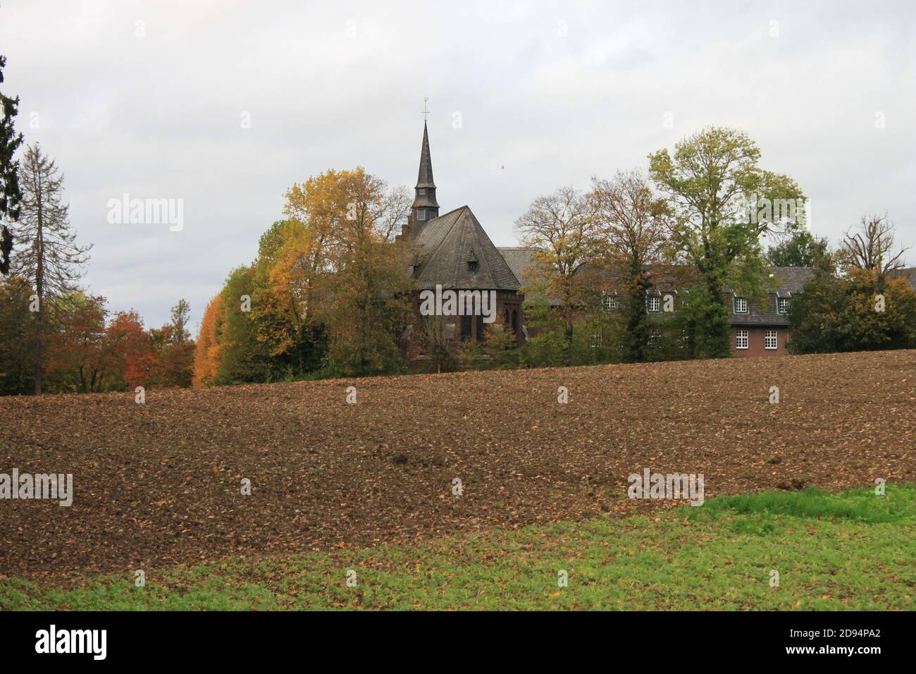 Monastery in an autumn forest Stock Photo - Alamy