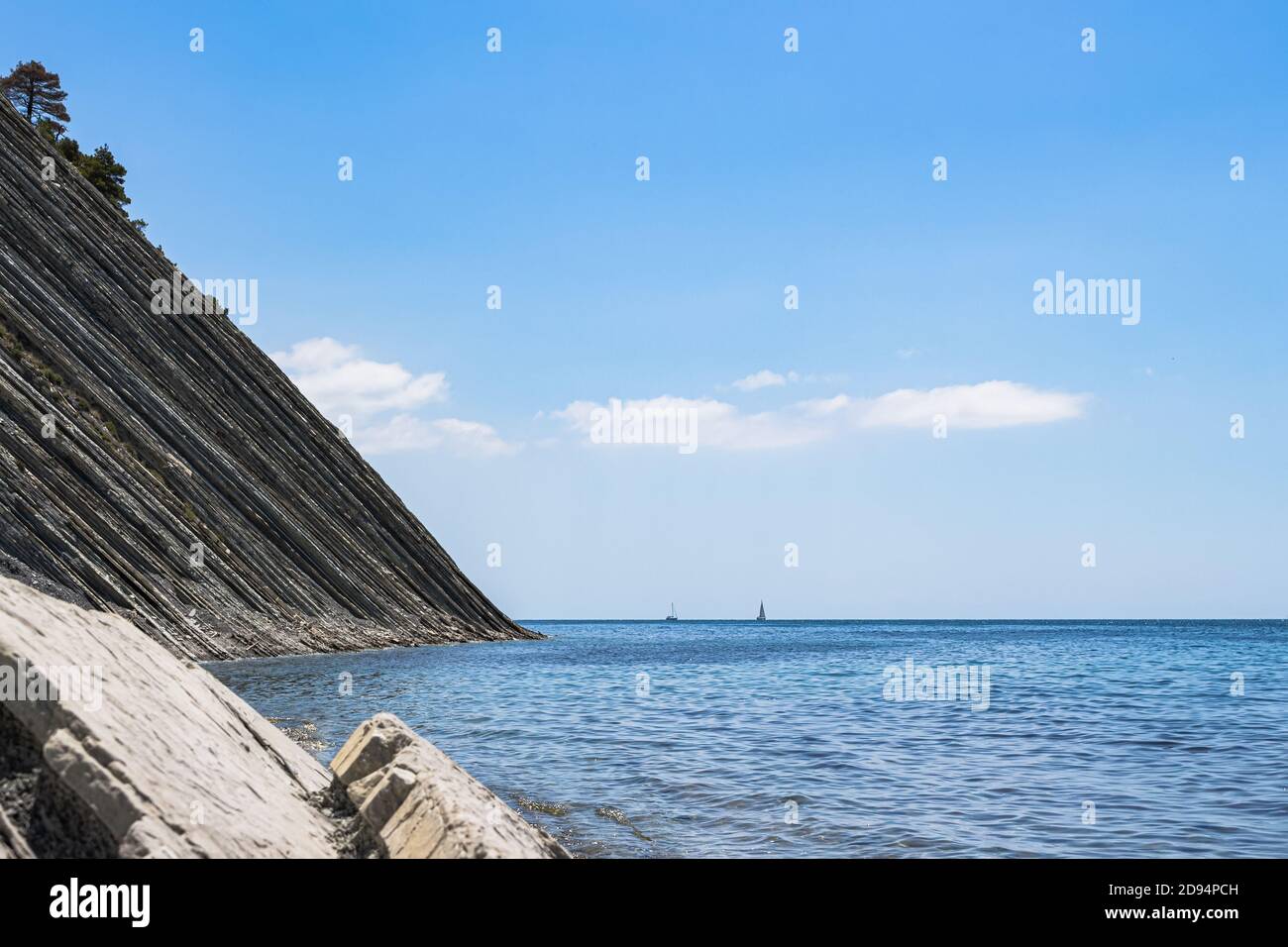 Picturesque summer landscape on a bright day. Stone wild beach, huge ...
