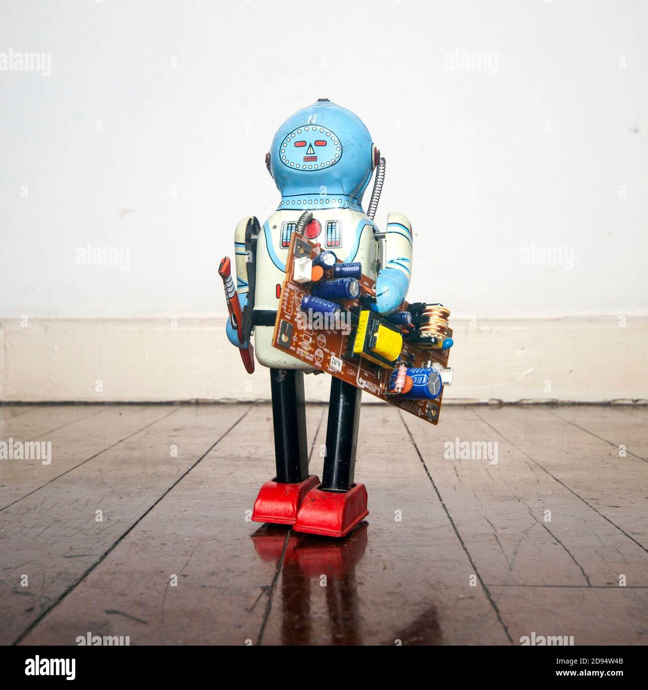 retro robot with his circuit board on a old wooden floor Stock Photo ...