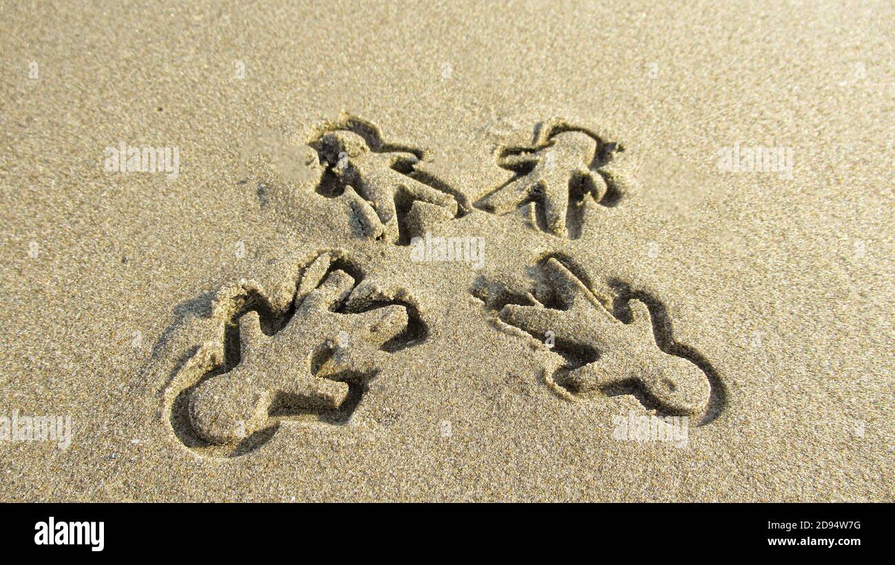 Human shapes carved on to the sea sand in a public beach Stock Photo ...
