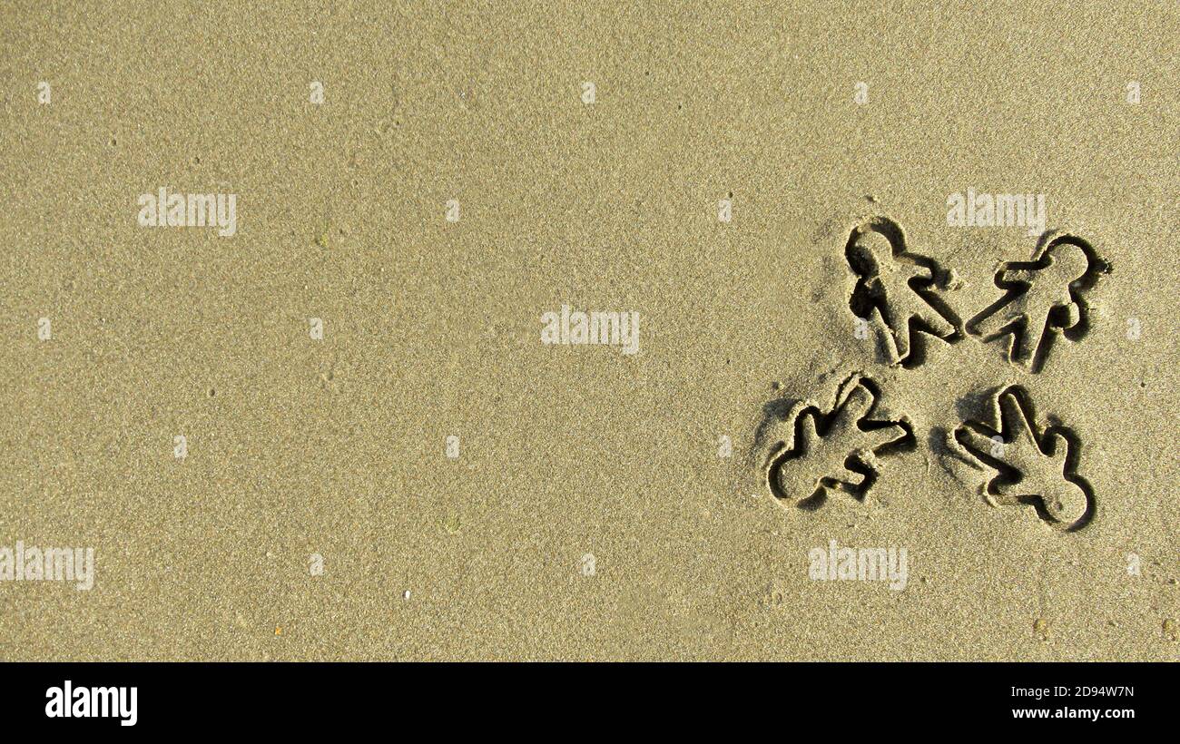 Human shapes carved on to the sea sand in a public beach Stock Photo ...