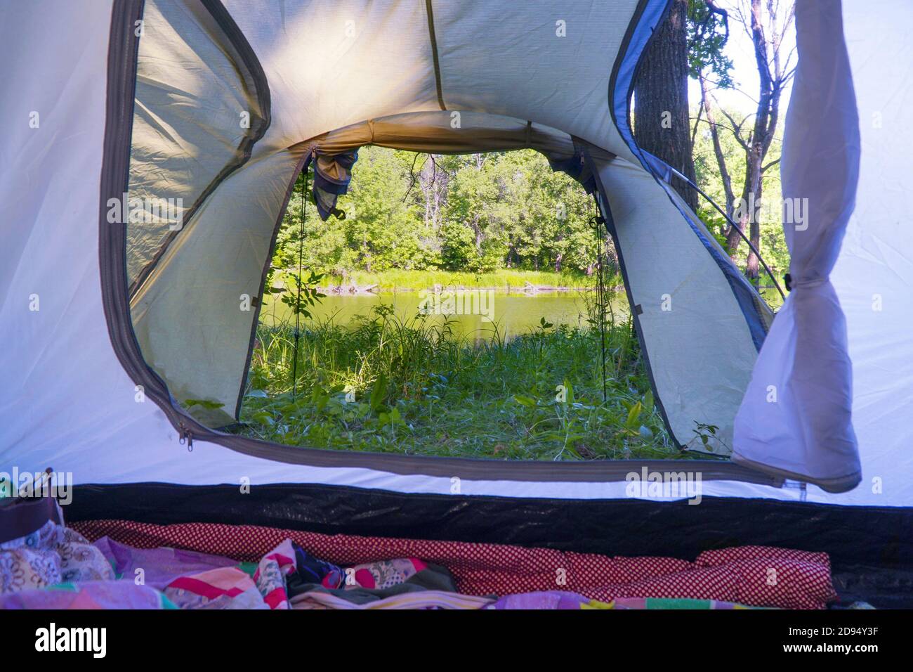 View from inside tent to the forest and lake Stock Photo - Alamy
