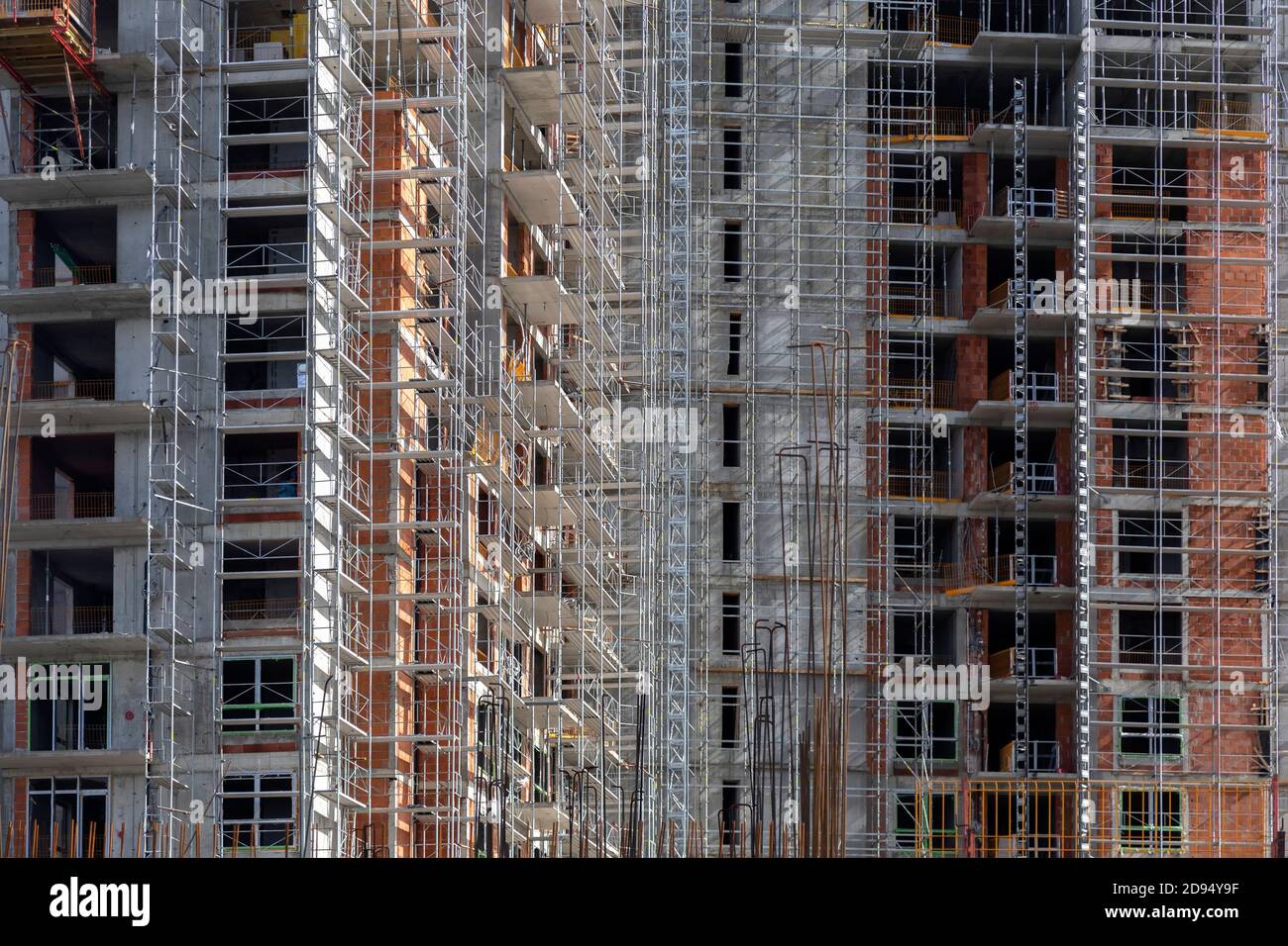 Building under construction with scaffolds background. Scaffolding ...