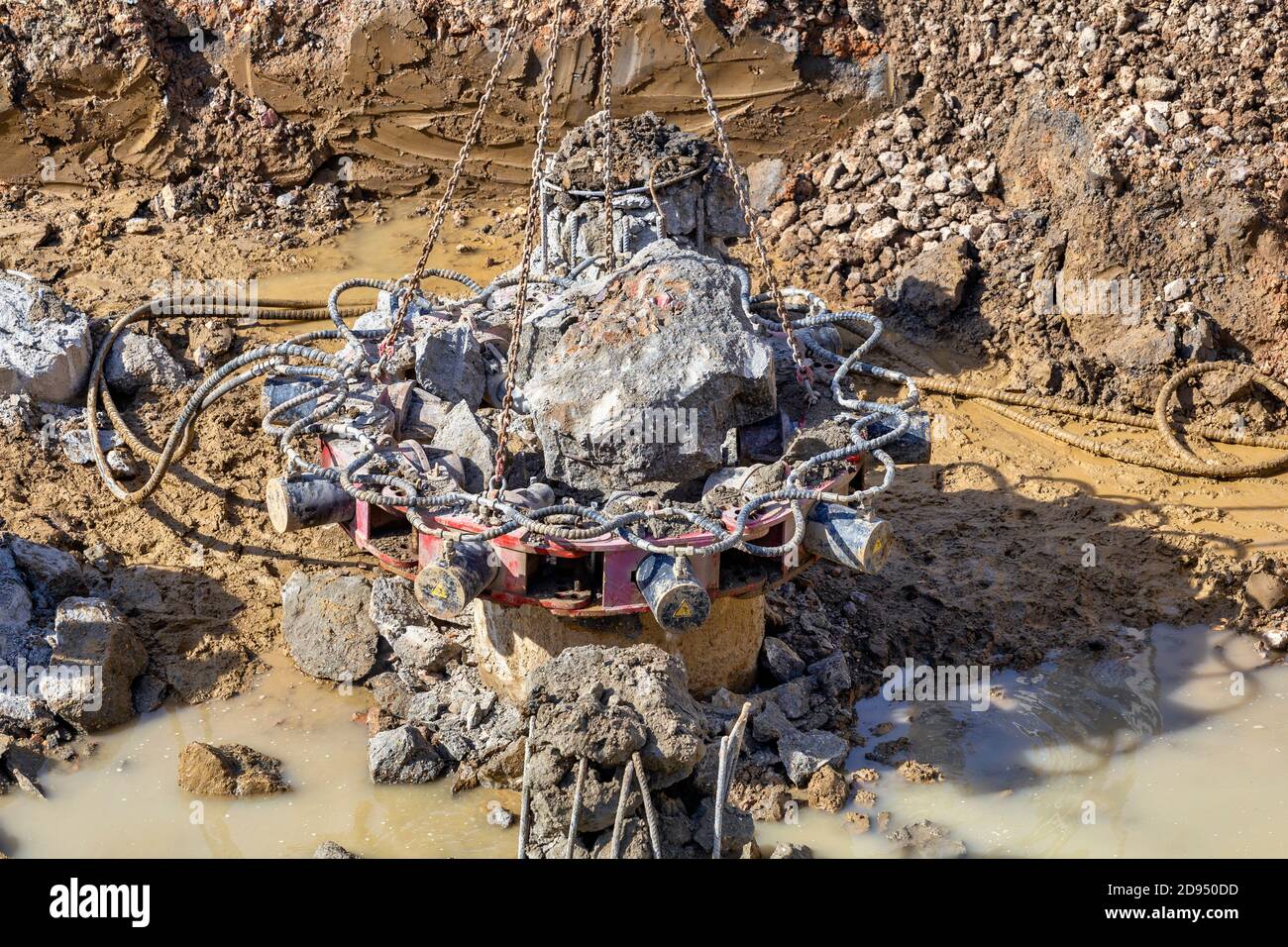 Pile foundation hydraulic concrete pile cutter, unit drops over the top ...