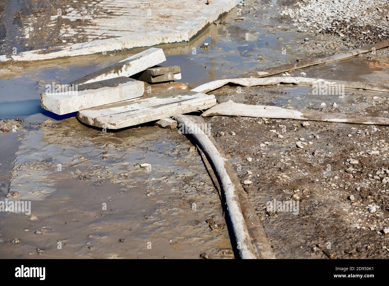 Pump hoses pumping flood water at construction site. Hoses oof ...