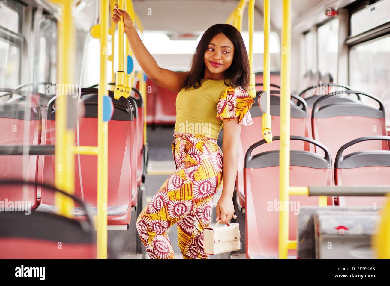 Young stylish african american woman riding on a bus Stock Photo - Alamy