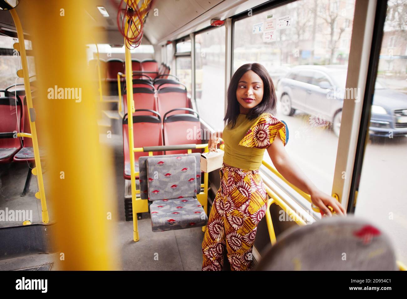Young stylish african american woman riding on a bus Stock Photo - Alamy