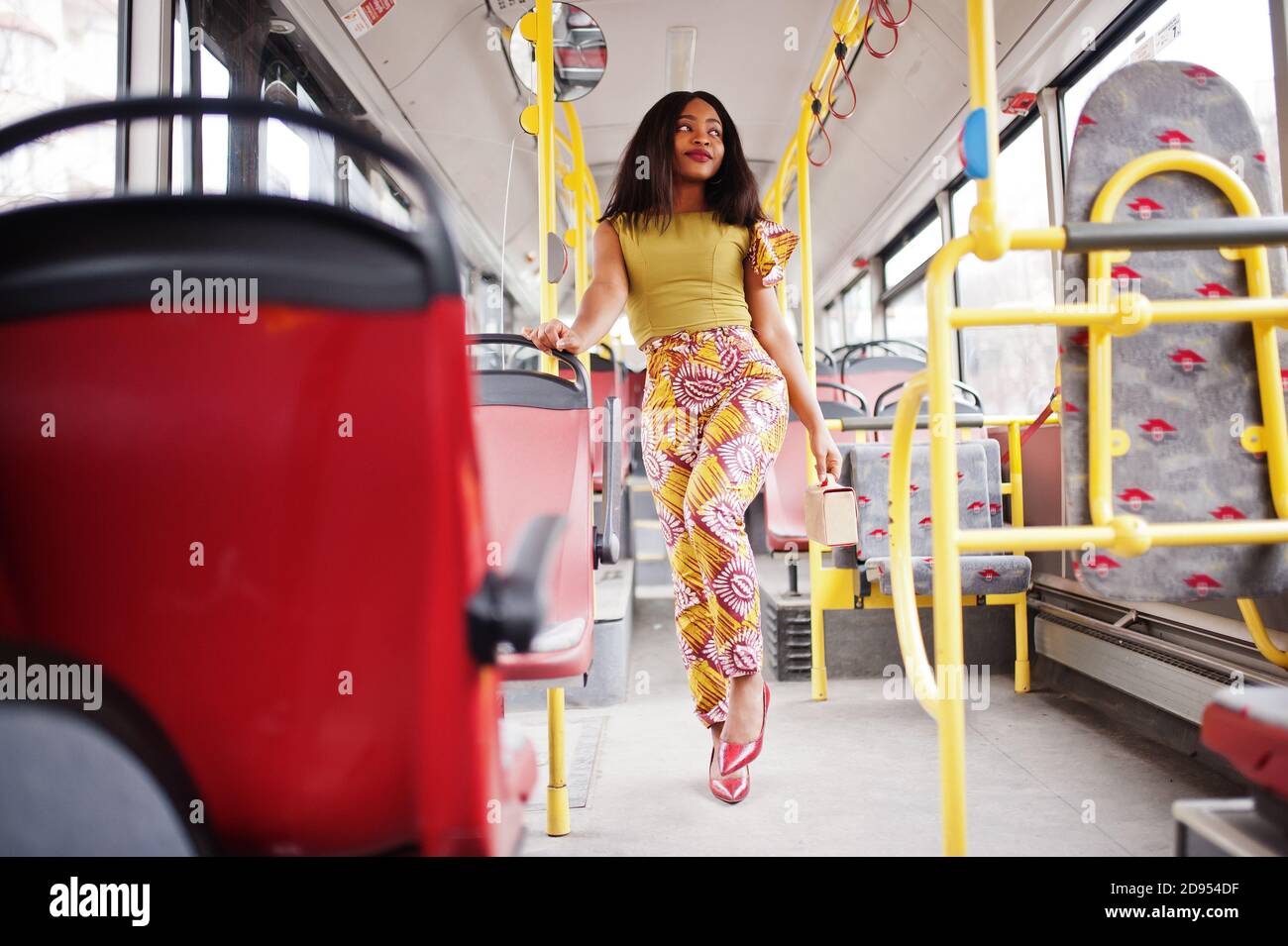 Young stylish african american woman riding on a bus Stock Photo - Alamy