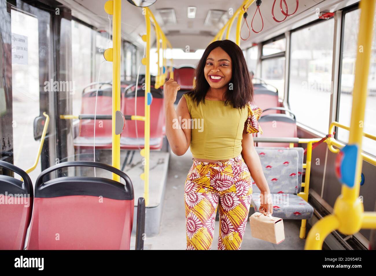 Young stylish african american woman riding on a bus Stock Photo - Alamy