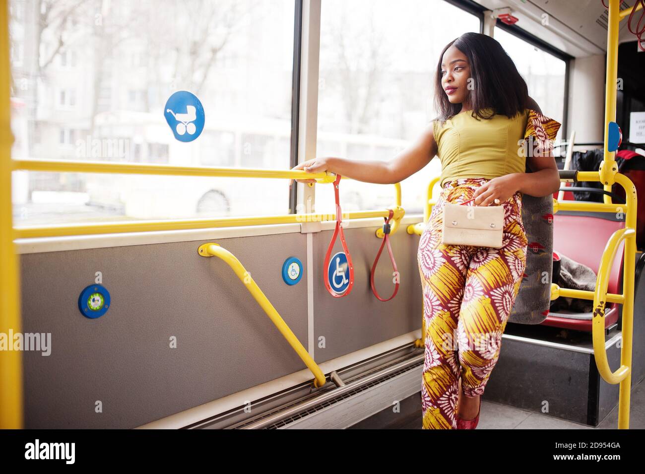 Young stylish african american woman riding on a bus Stock Photo - Alamy