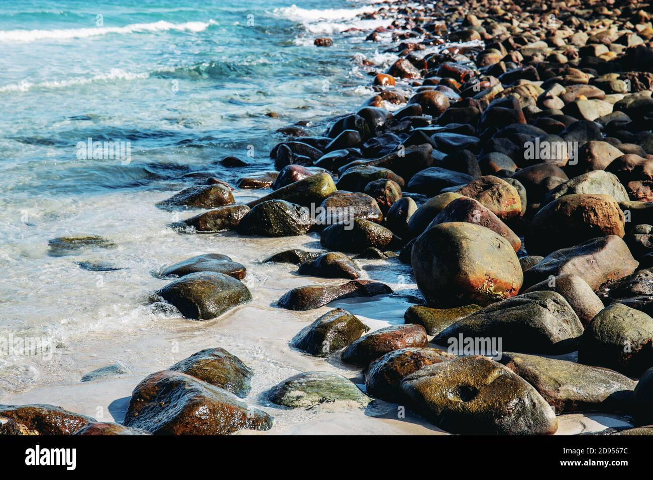 Stone on beach at the sunlight with background Stock Photo - Alamy