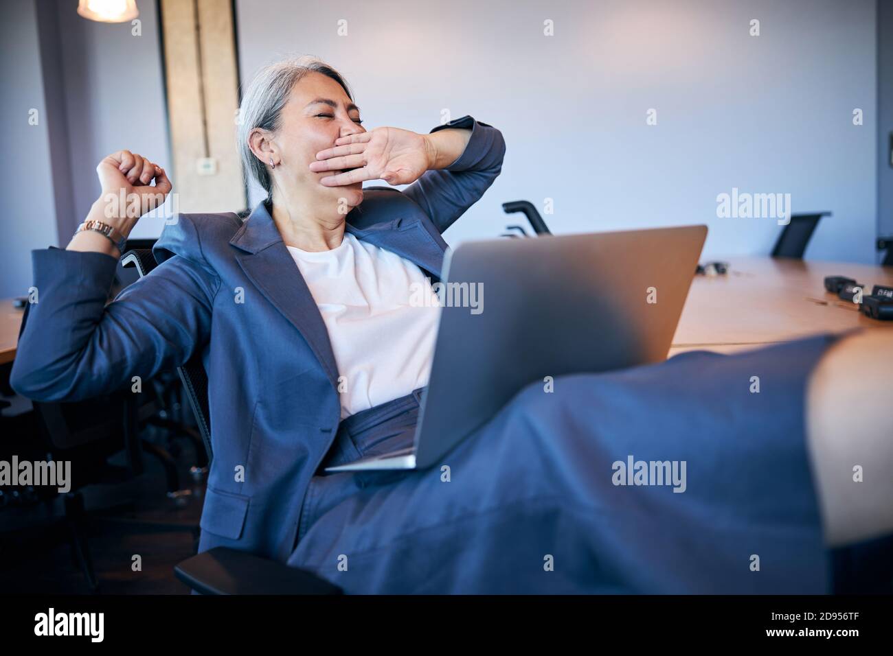 Tired executive woman yawning hi-res stock photography and images - Alamy