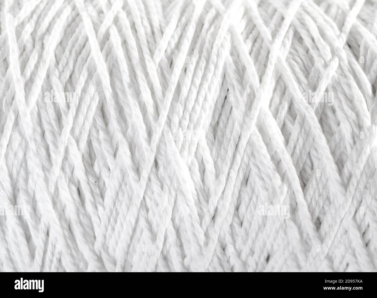 Roll of white rope isolated on white background Stock Photo - Alamy