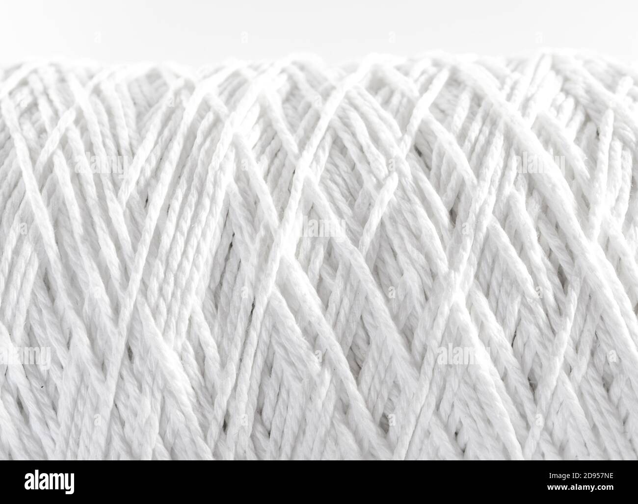Roll of white rope isolated on white background Stock Photo - Alamy