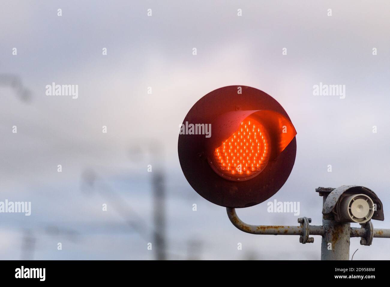 Red light at the traffic light at the railway crossing. Close up Stock ...
