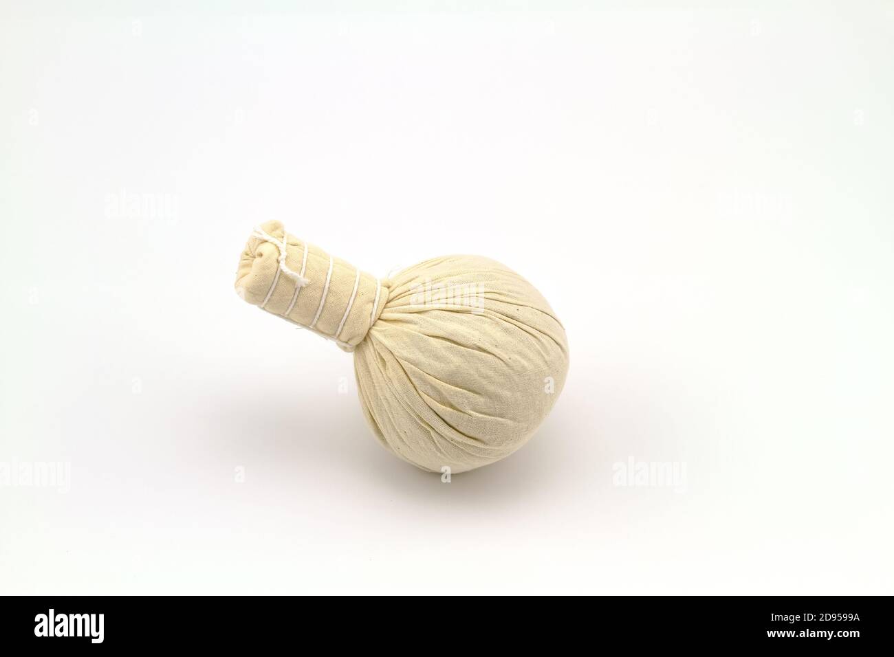 Spa herbal compressing ball on white background Stock Photo - Alamy