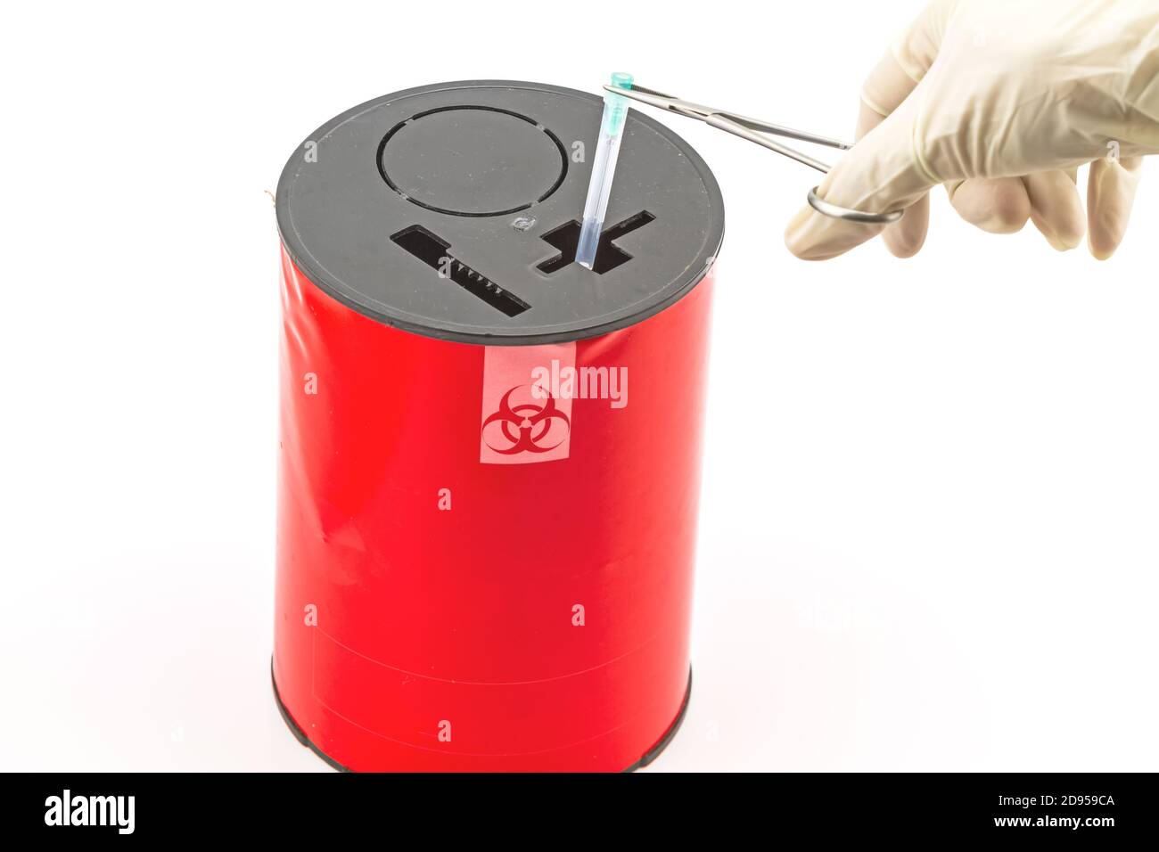 Doctor put needle in red disposal boxes on white background Stock Photo ...