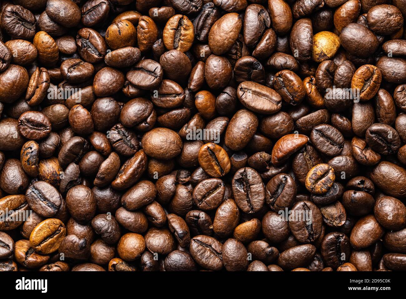 Mixed coffee beans. Arabica and robusta. Top view Stock Photo - Alamy