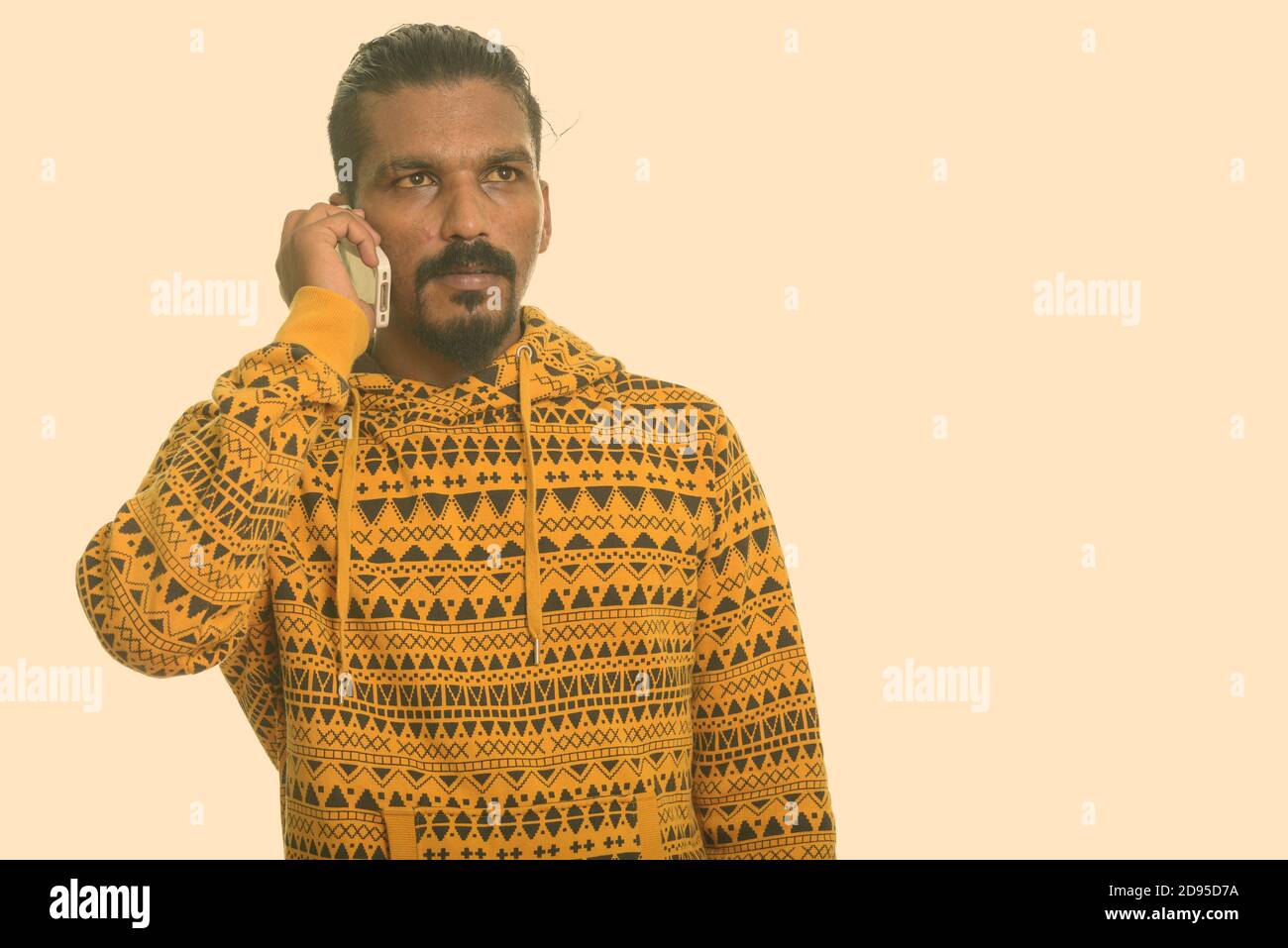 Young Indian man talking on mobile phone Stock Photo - Alamy