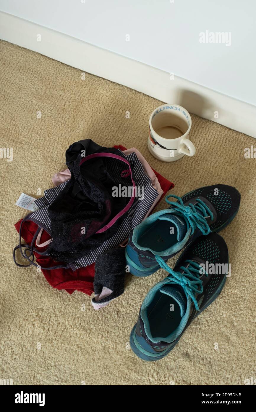 Pile of clothes on floor hi-res stock photography and images - Alamy
