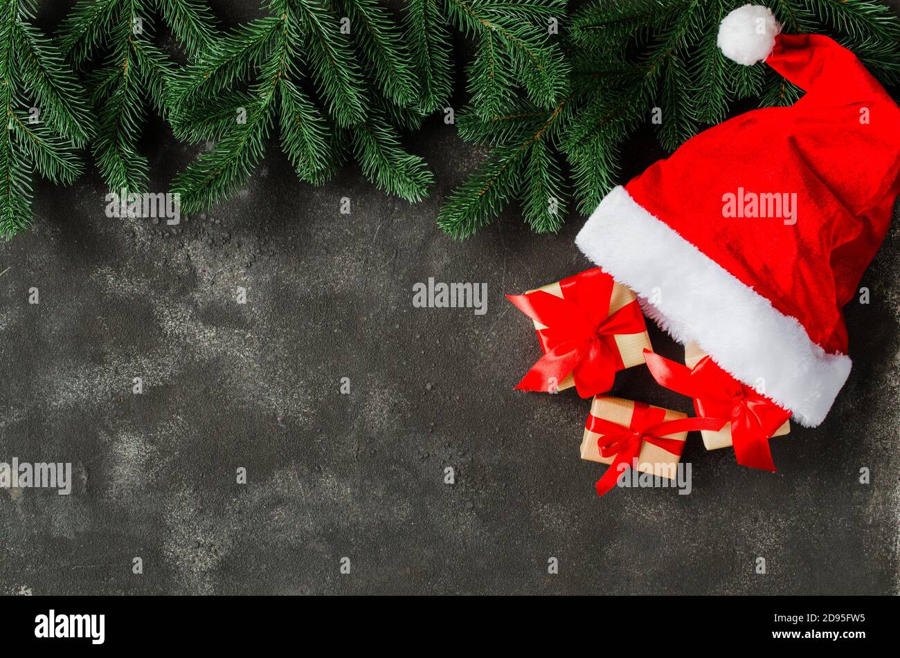 Christmas gift boxes in Santa Claus hat Stock Photo - Alamy