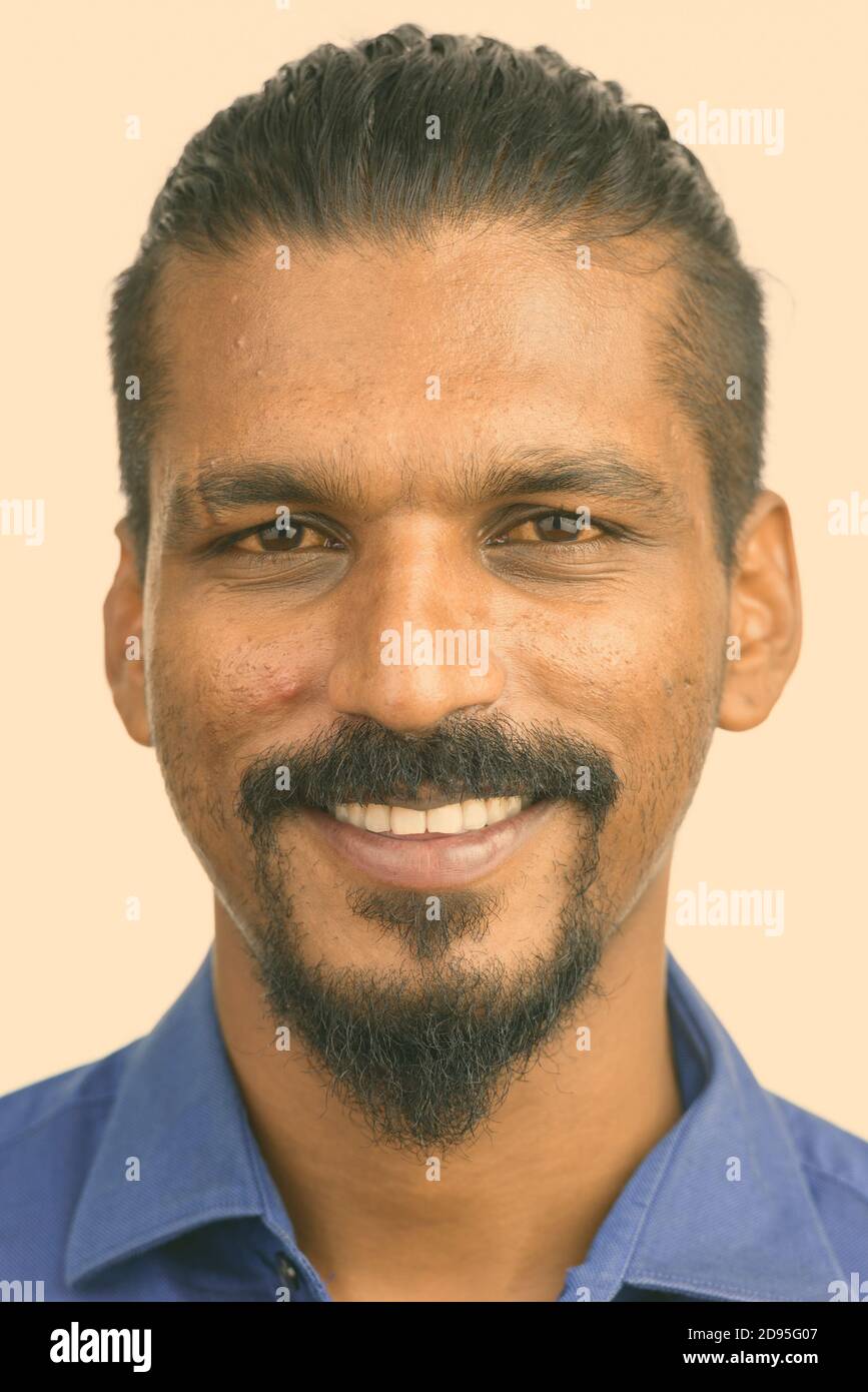 Face of young happy Indian businessman smiling Stock Photo - Alamy