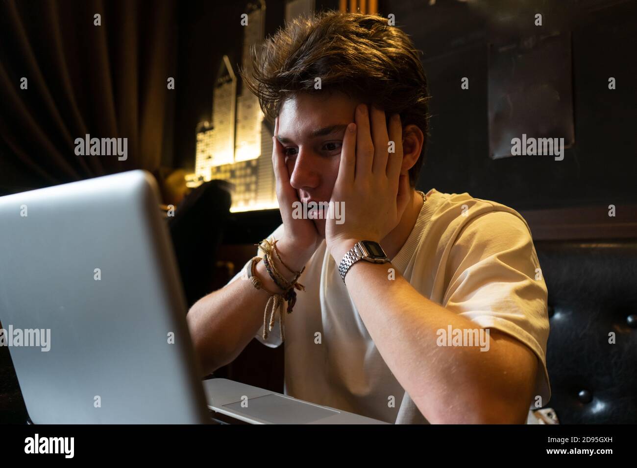 Teen surprised looking computer screen hi-res stock photography and ...
