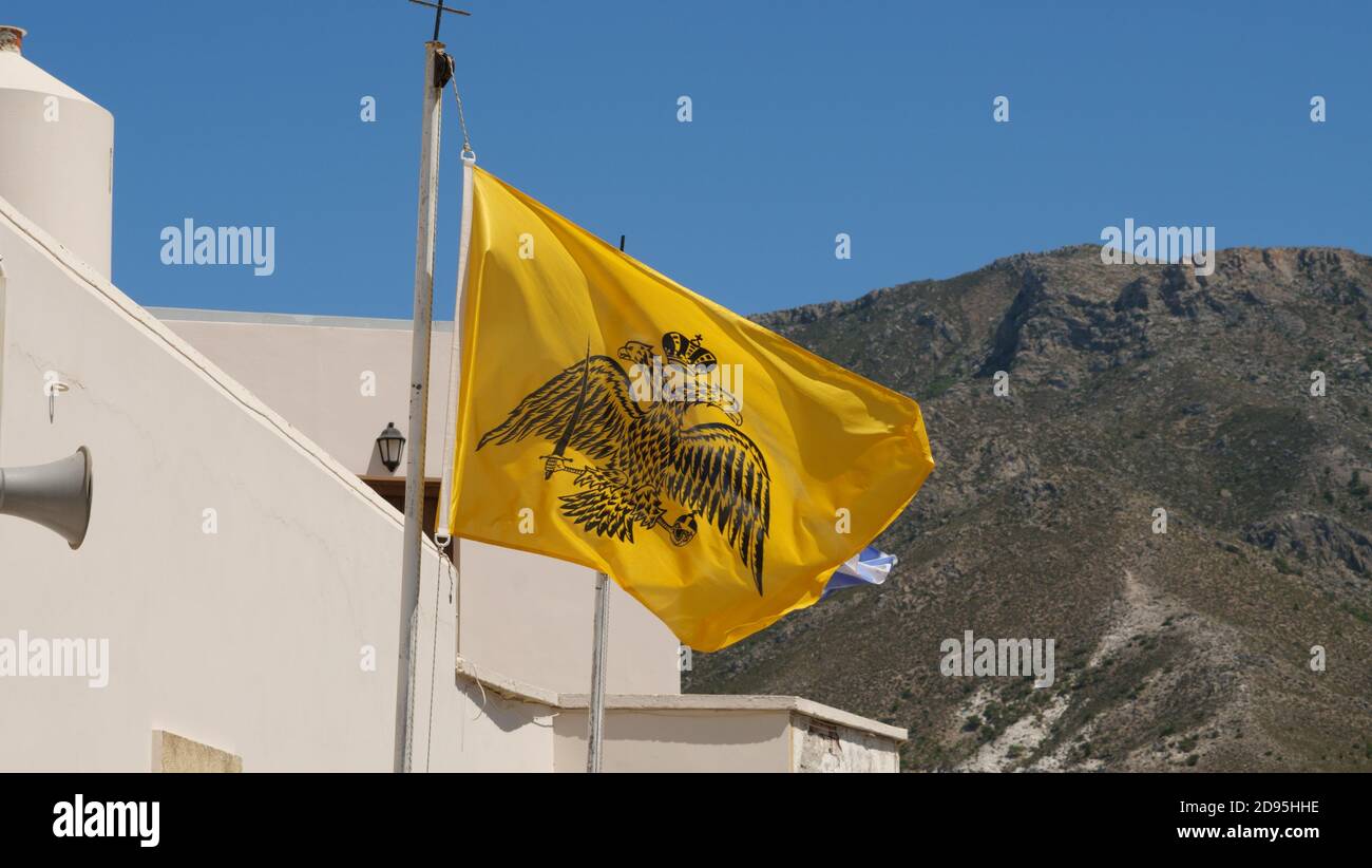 Flag of Mount Athos captured during the daytime in Crete, Greece Stock ...