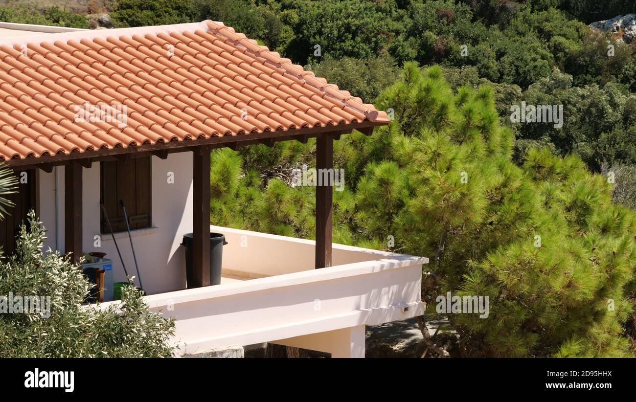 High angle shot of the balcony of a building in the woods captured in ...