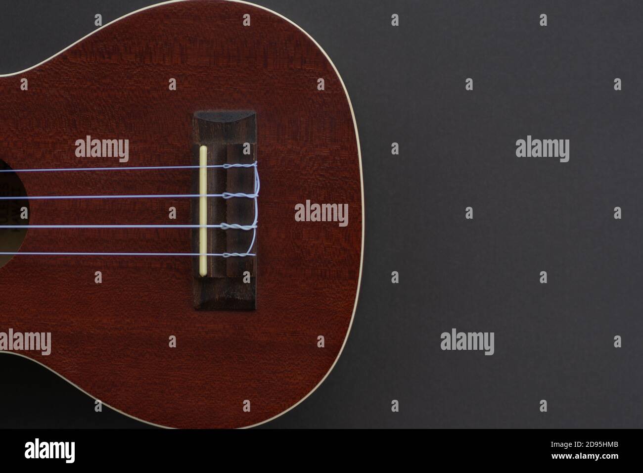 Closeup shot of a ukulele soundboard part on a black background Stock ...