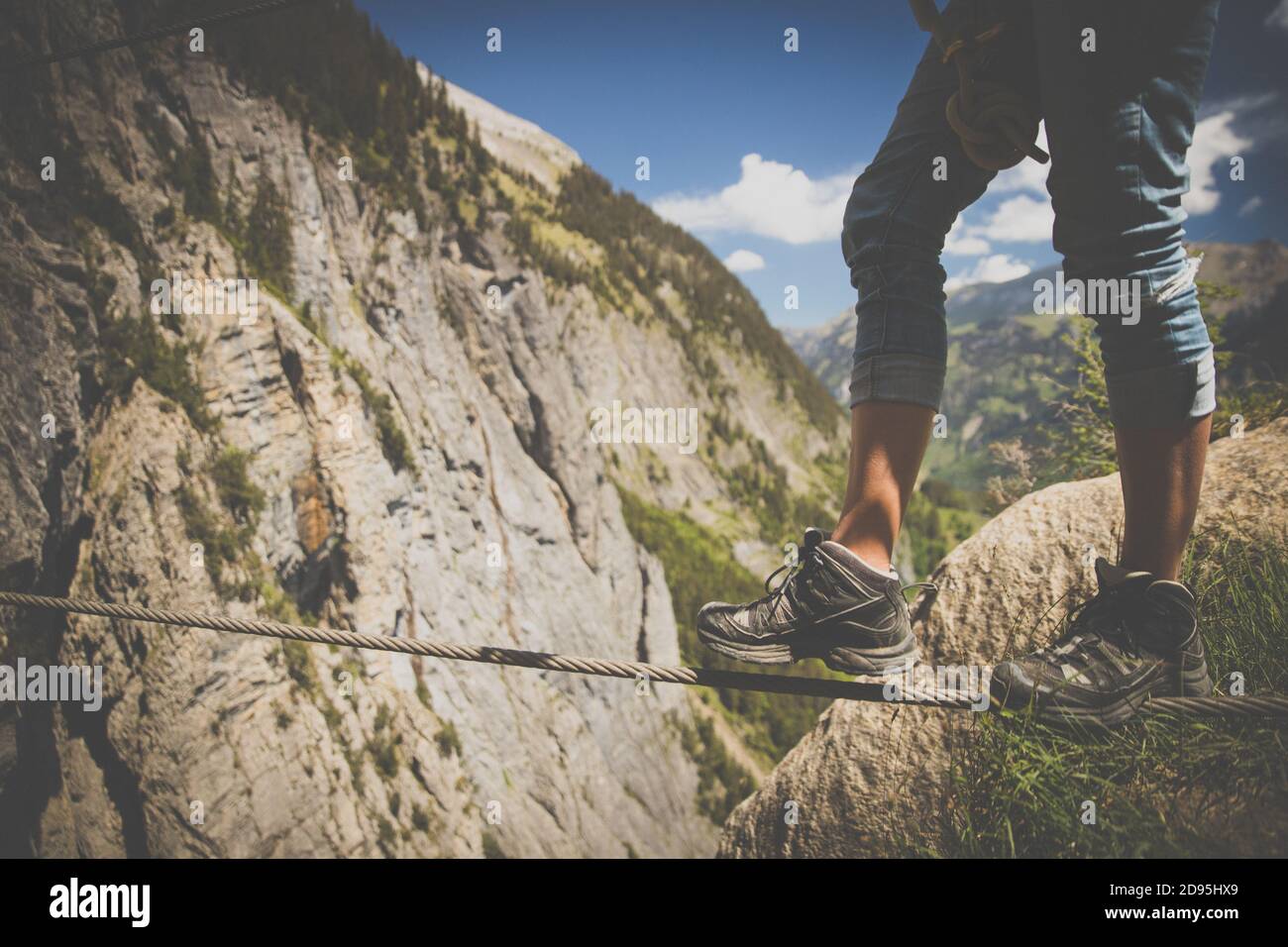 Man on a via ferrata, walking on an iron rope. Kandersteg - amazing ...