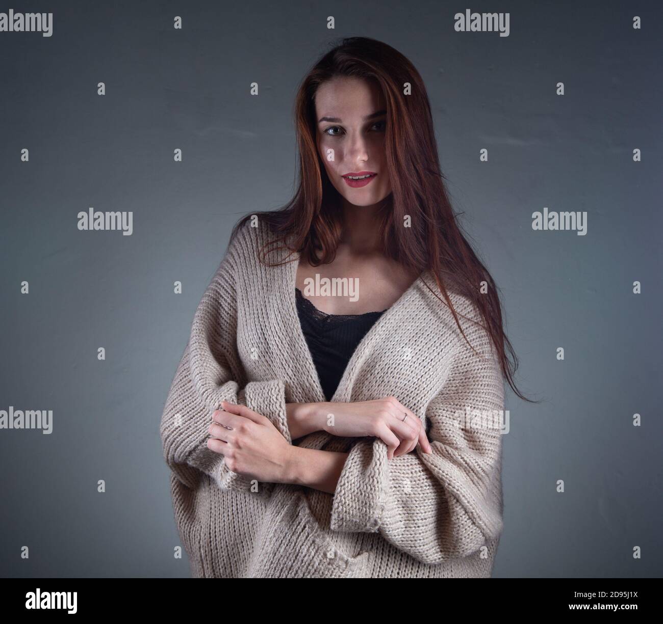 Shot of young woman with long hair in shadows Stock Photo - Alamy
