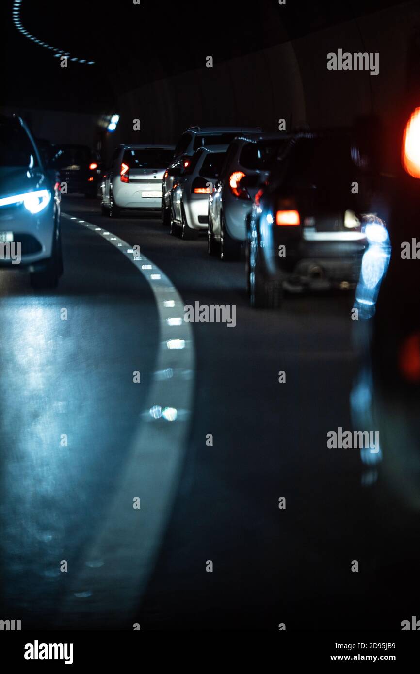 Heavy Traffic Inside A Highway Urban Tunnel. Cars going slow through a ...