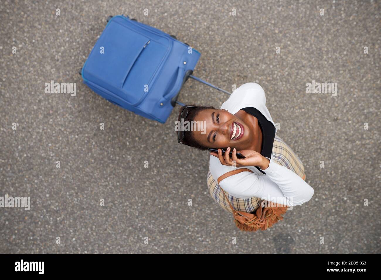 Portrait from above of happy african american woman walking with ...