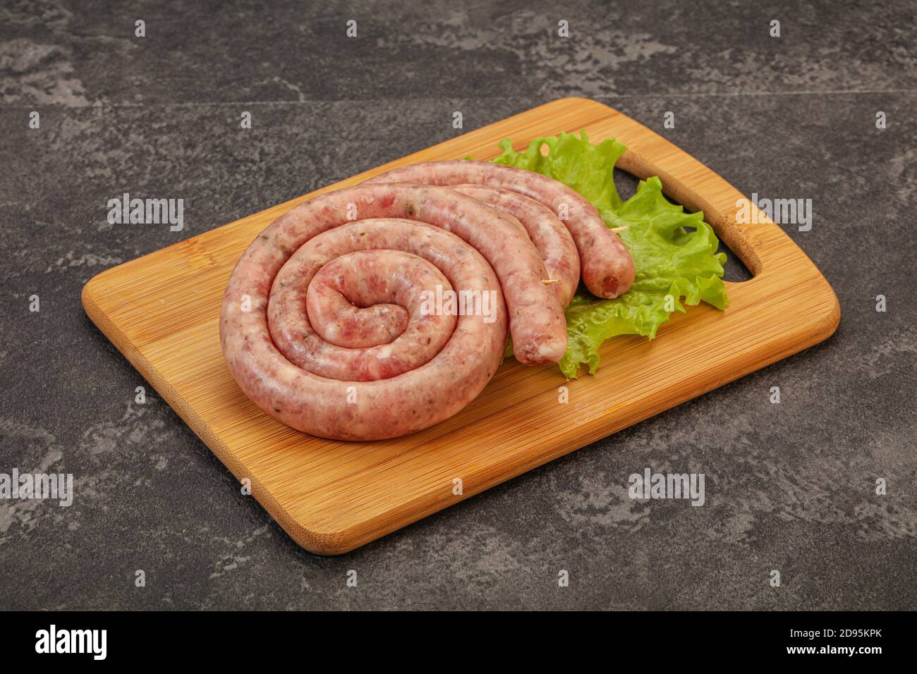 Raw pork sausage ring for grill Stock Photo - Alamy