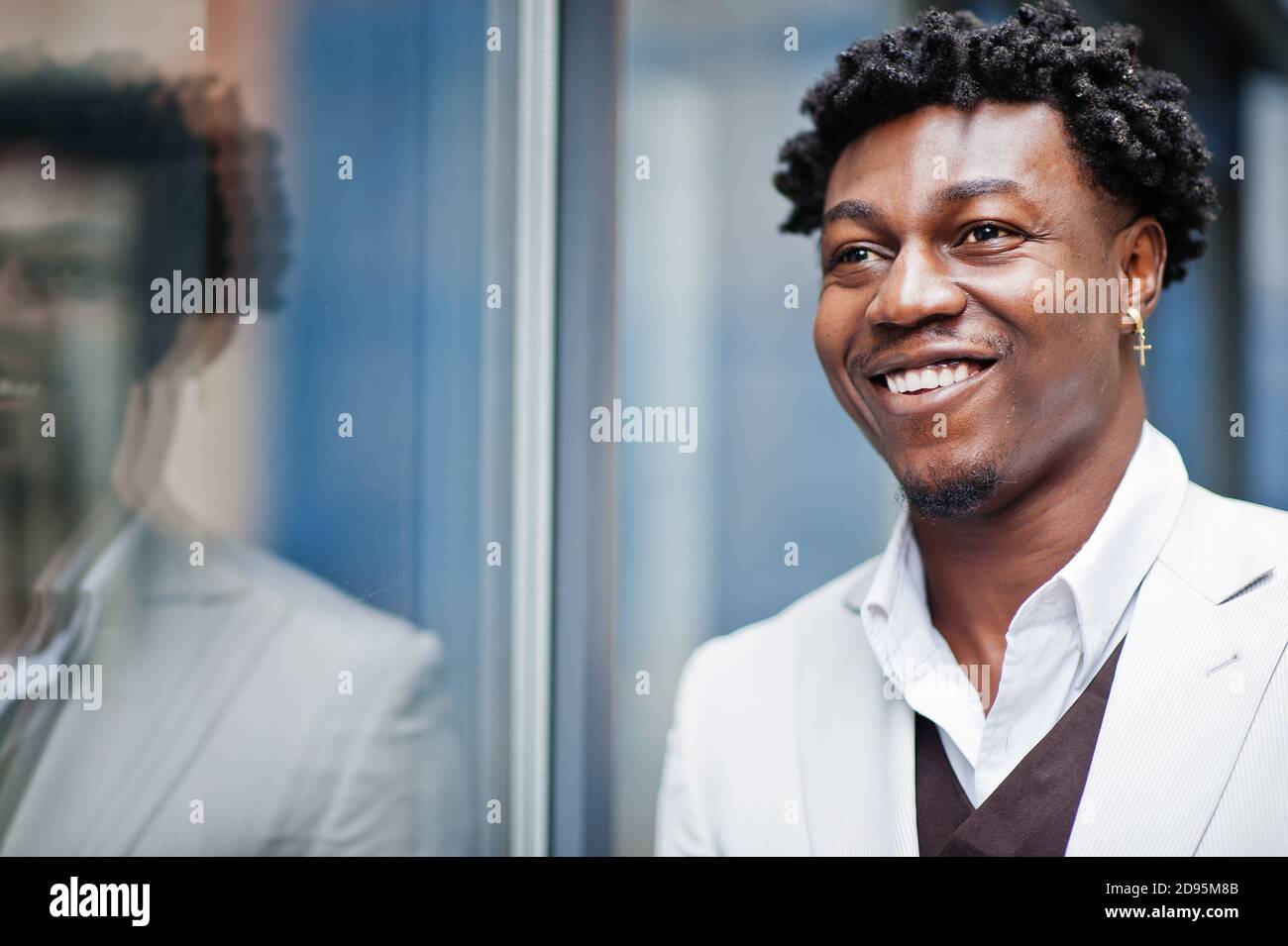 Thoughtful young handsome african american gentleman in formalwear ...