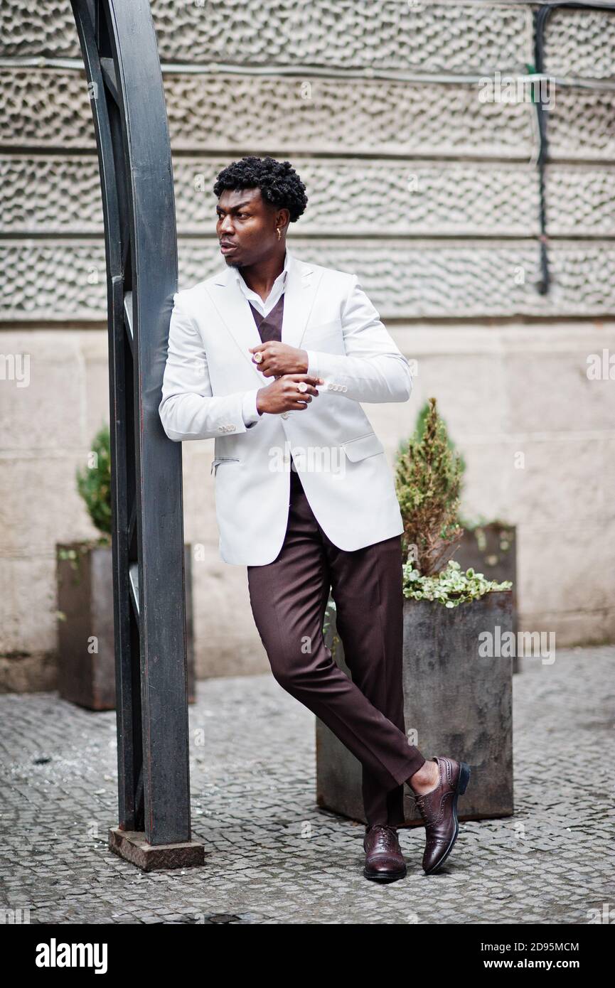 Thoughtful young handsome african american gentleman in formalwear ...