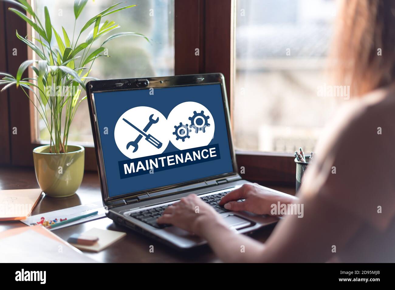 Laptop screen displaying a maintenance service concept Stock Photo - Alamy